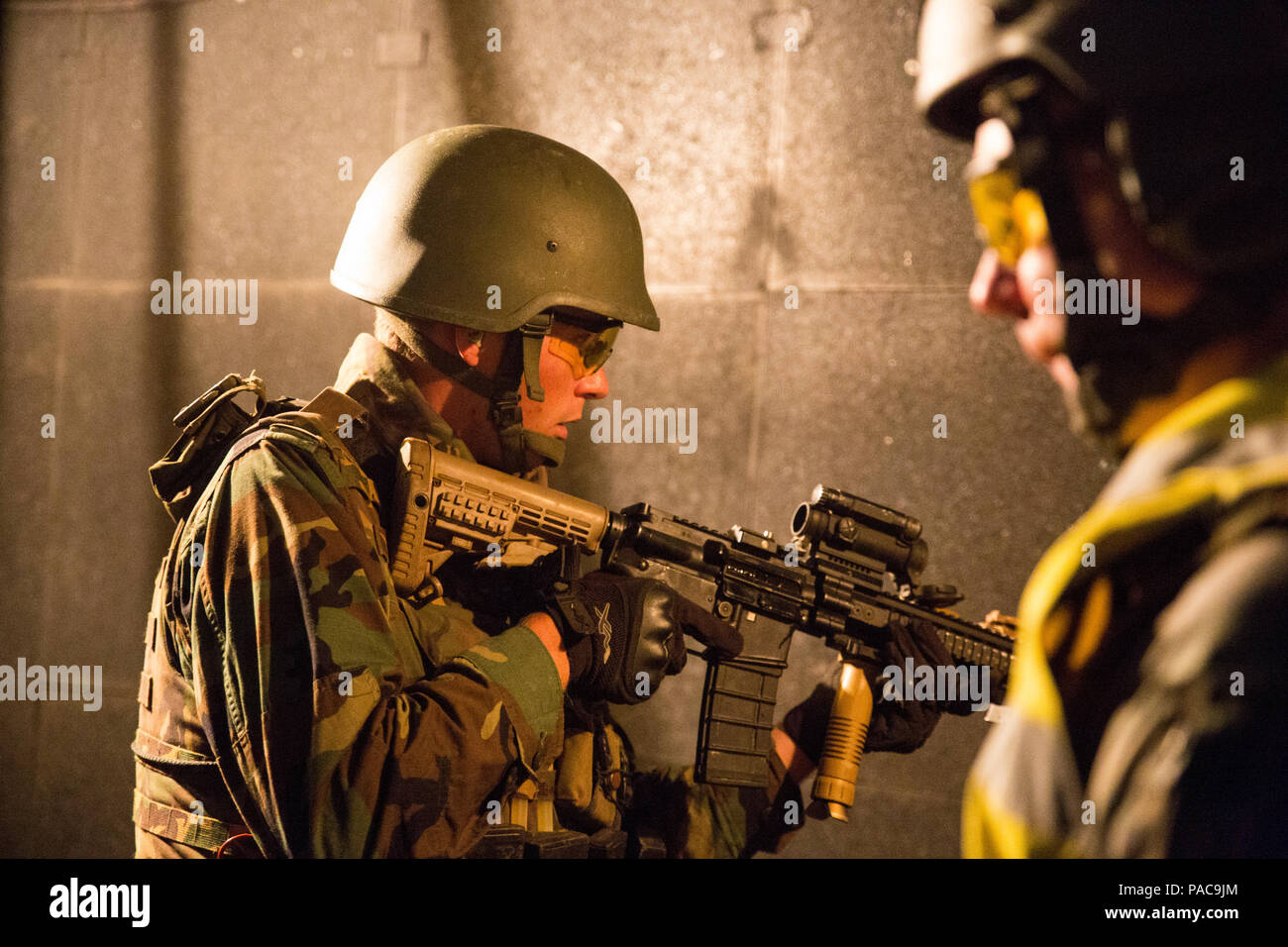 A Dutch Marine with the 32nd Raiding Company prepares to breach the ...