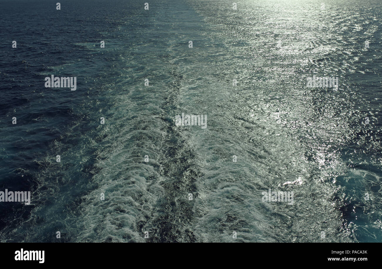 Wake of a cruise ship against the light Stock Photo - Alamy
