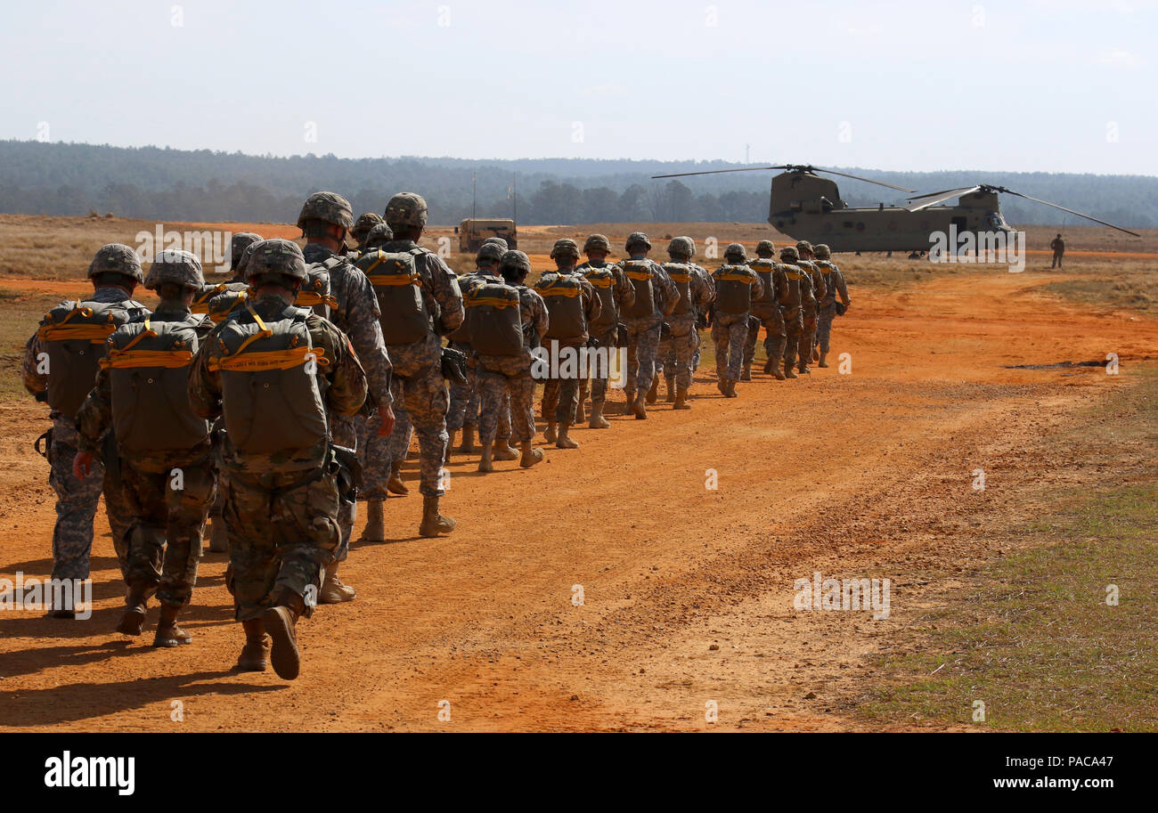 Paratroopers assigned to the 82nd Airborne Division walk to a Ch-47 on ...