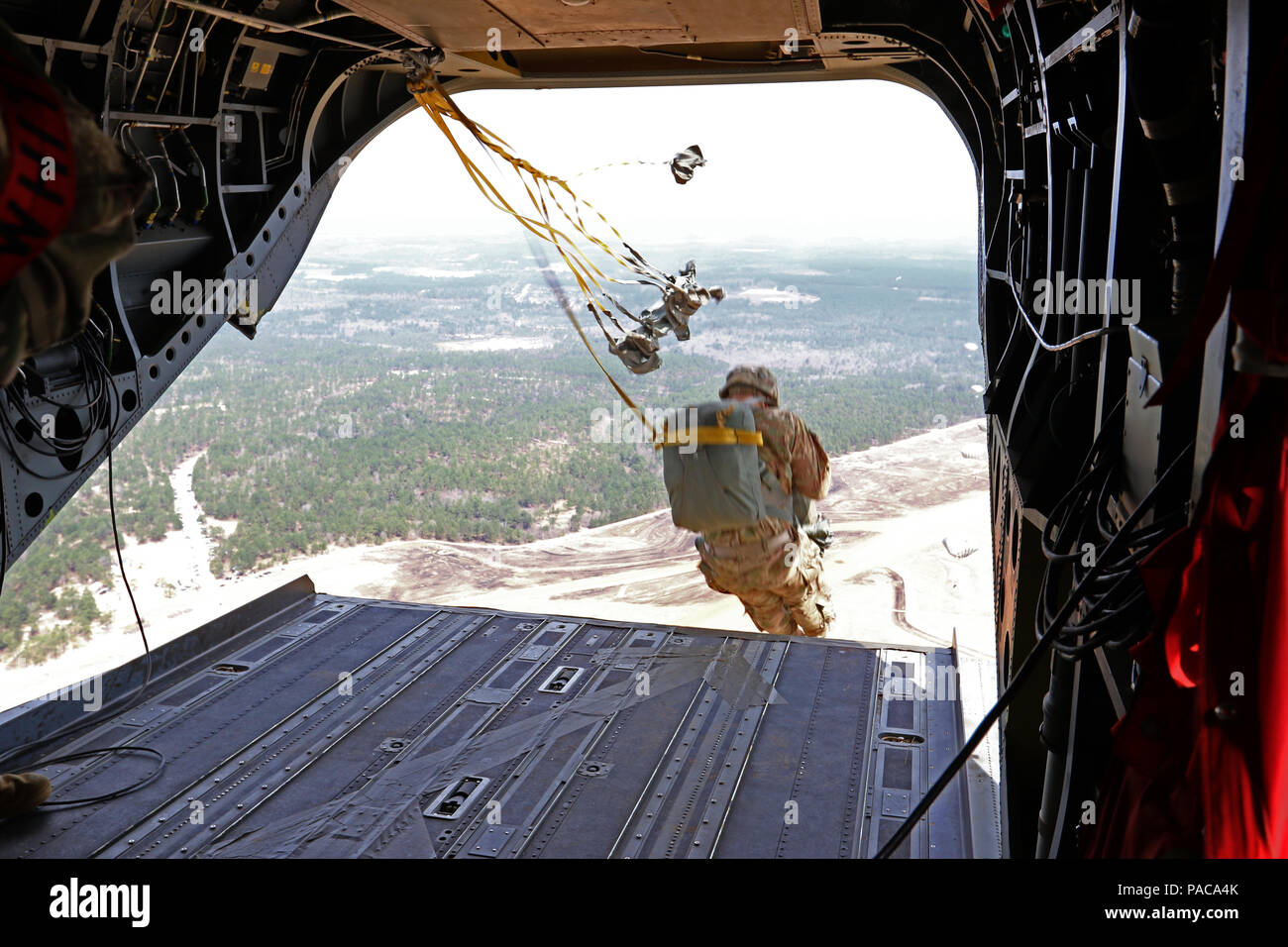 A Paratrooper assigned to the 82nd Airborne Division walks off a Ch-47 ...