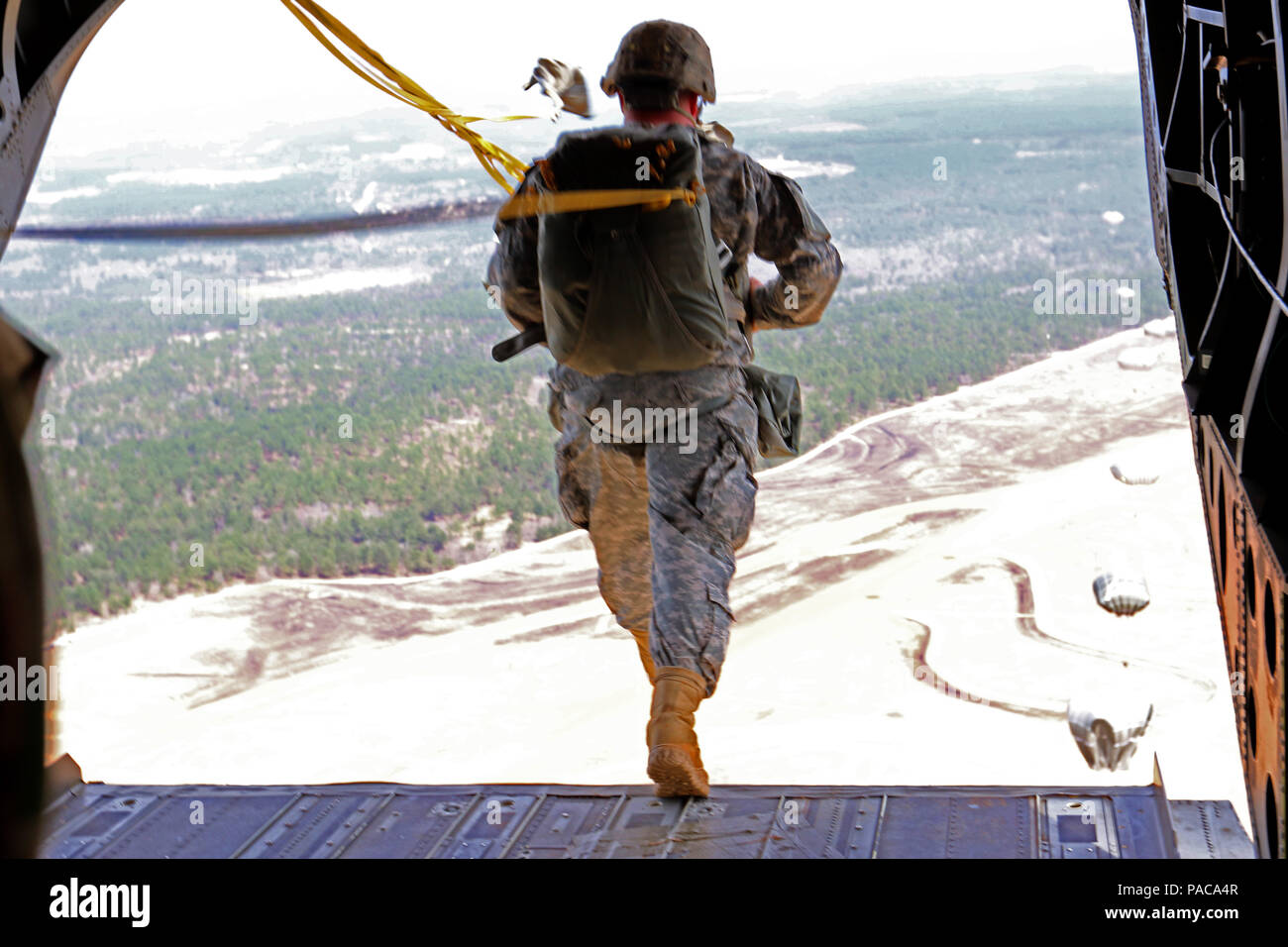 A Paratrooper assigned to the 82nd Airborne Division walks off a Ch-47 ...