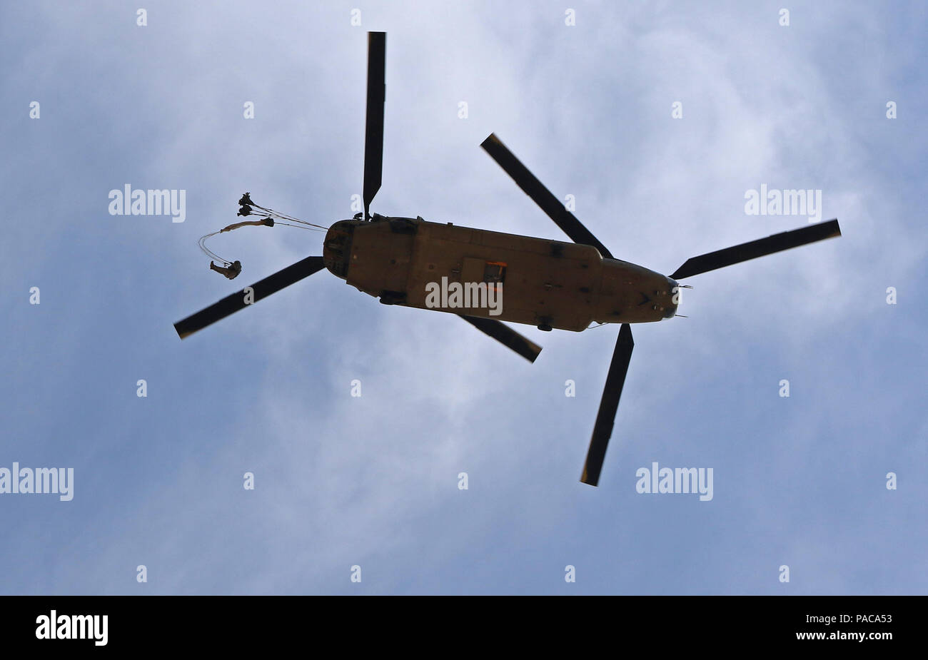A Paratrooper assigned to the 82nd Airborne Division exits from a Ch-47 ...