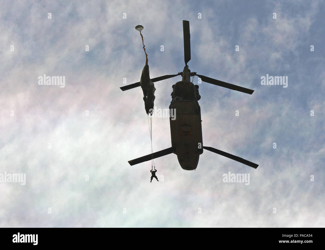 A Paratrooper assigned to the 82nd Airborne Division exits from a Ch-47 ...