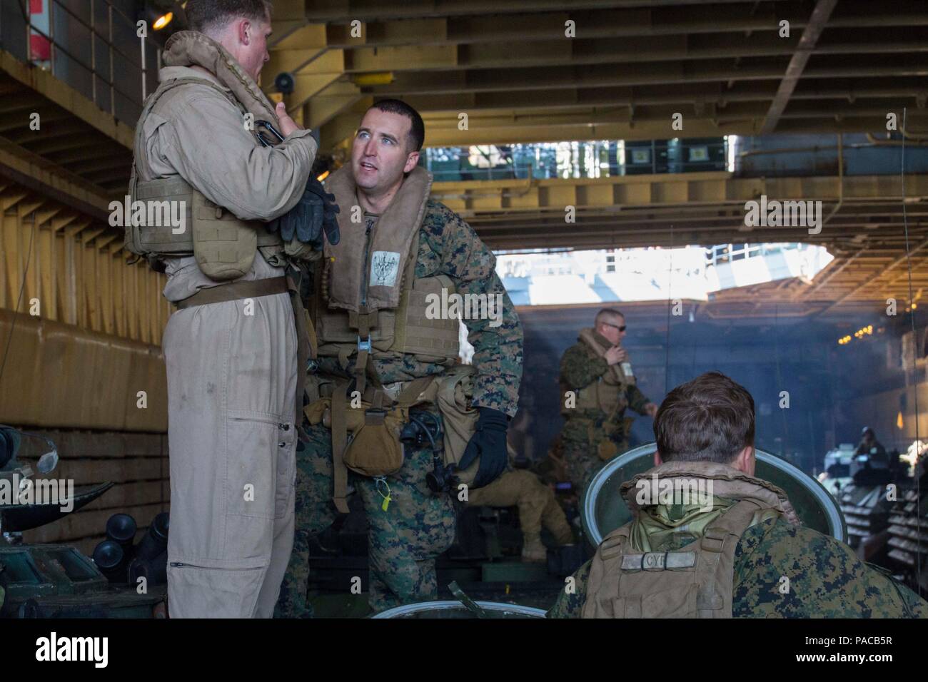 U.S. Marine Capt. Joseph Fontanetta, center, speaks with 1st Lt ...