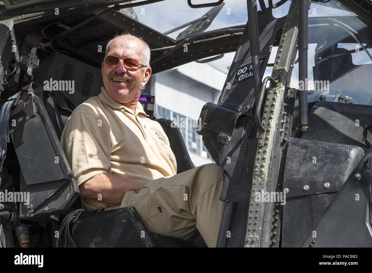Pat Leary, a Vietnam veteran pilot sits in the pilot’s seat of an AH-64 ...