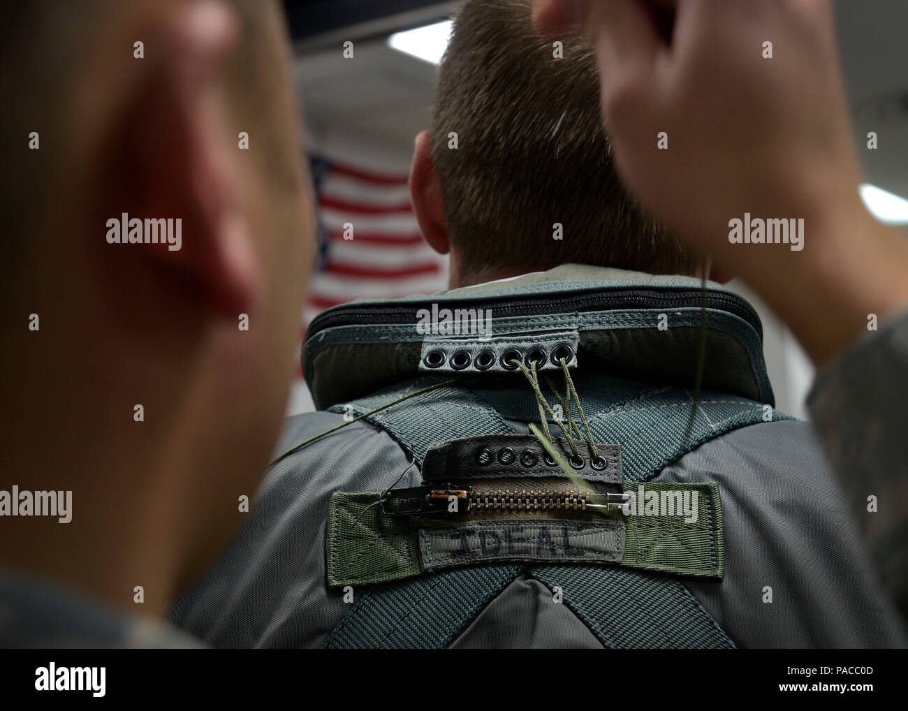 U.S. Air Force Senior Airman Danny Lo, an Aircrew Flight Equipment ...
