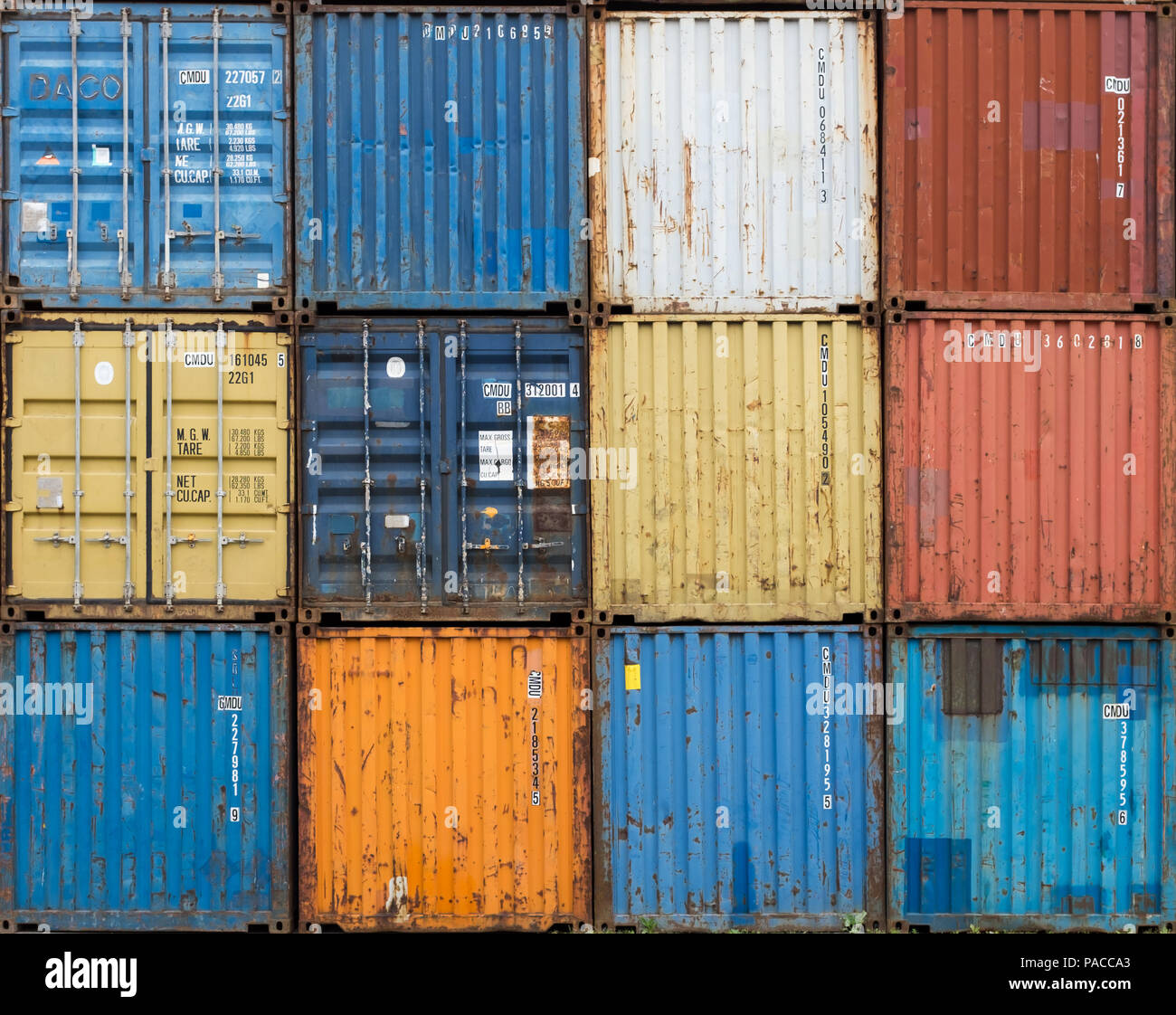 Stack of colorful and rusty containers in the port of Antwerp Stock ...