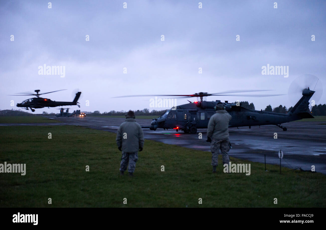 Crew Chiefs from the 56th Rescue Squadron observe an HH-60G Pave Hawk ...
