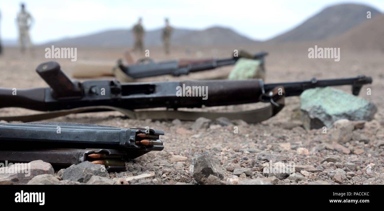 Rifles and ammo sit ready for firing March 10, 2016, during basic rifle ...