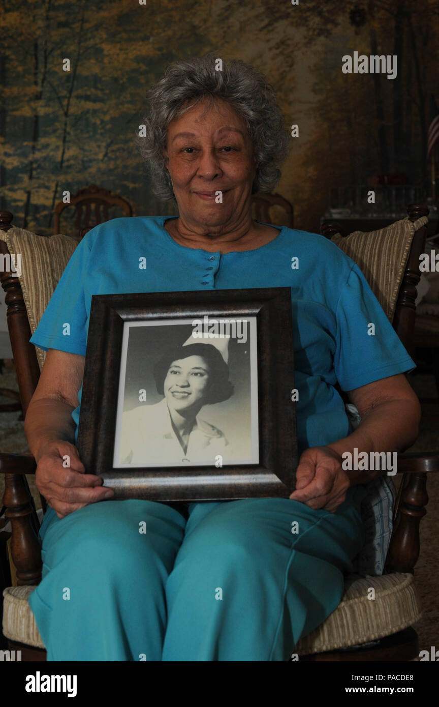 Retired Lt. Col Mattie Boyd, poses with a photo of herself when she was ...