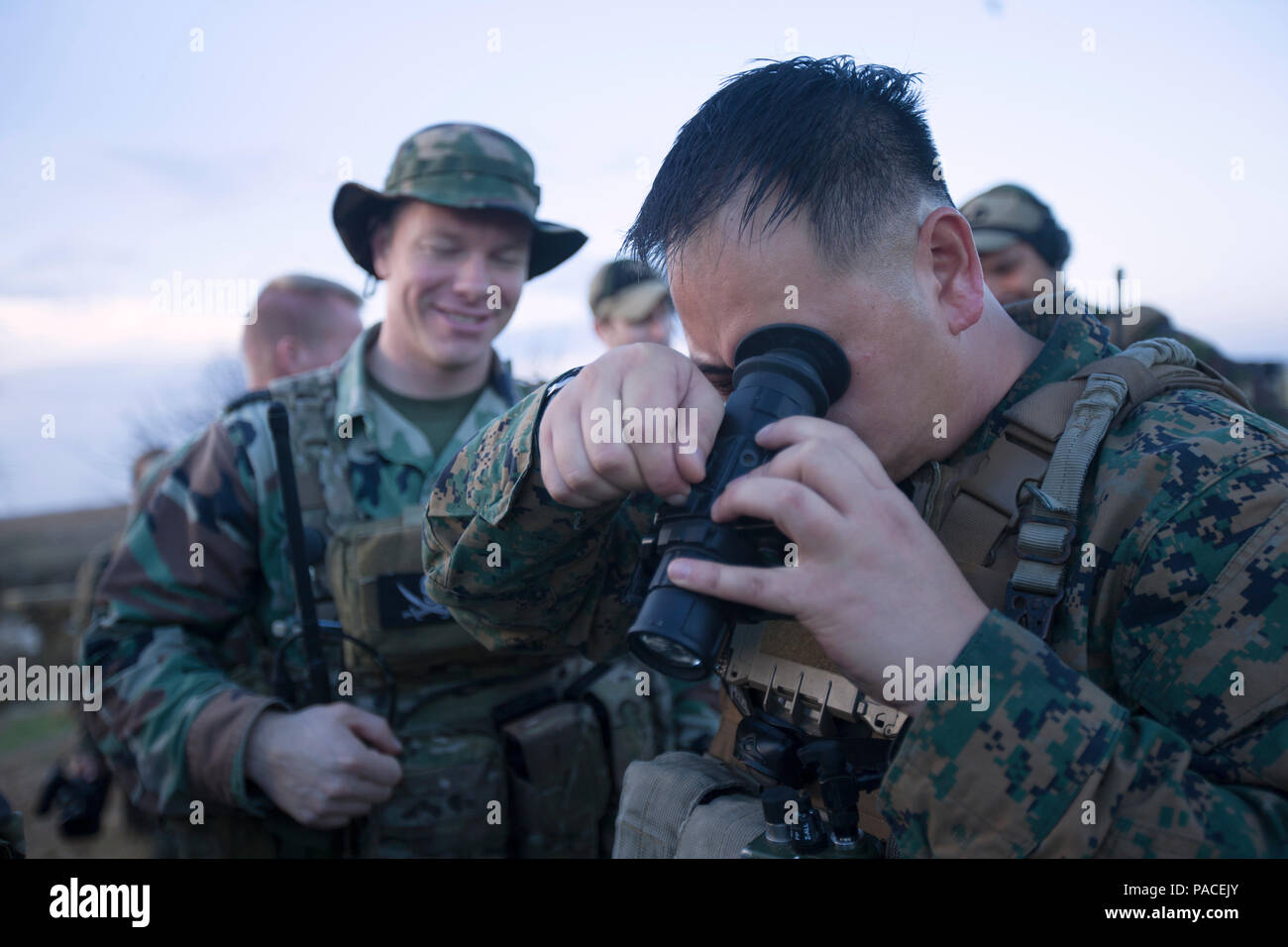 U.S. Marine Corps Gunnery Sgt. George R. Latham, right, a fire support ...