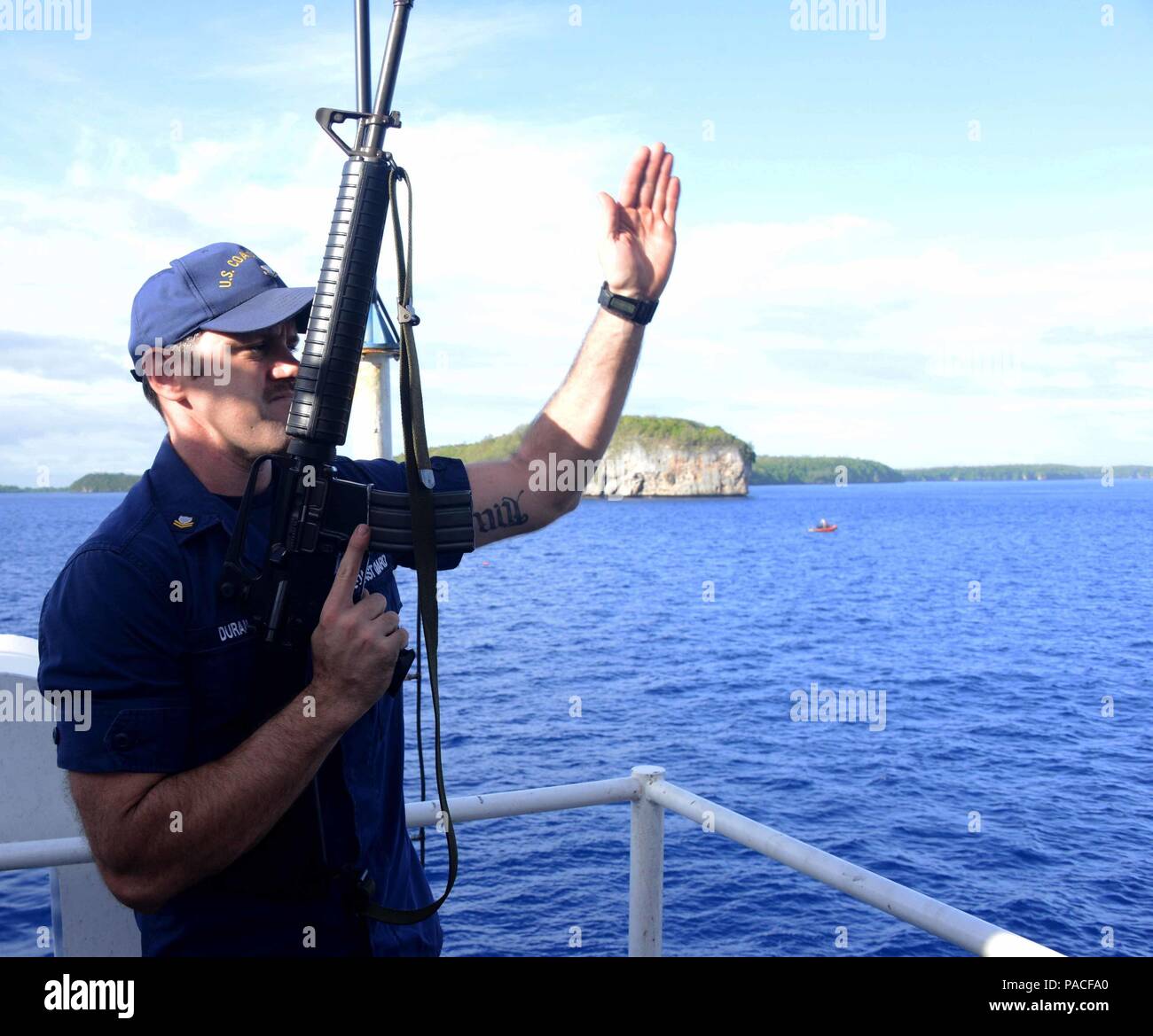 Petty Officer 2nd Class Nicholas Duran, a boatswain's mate, stands ...