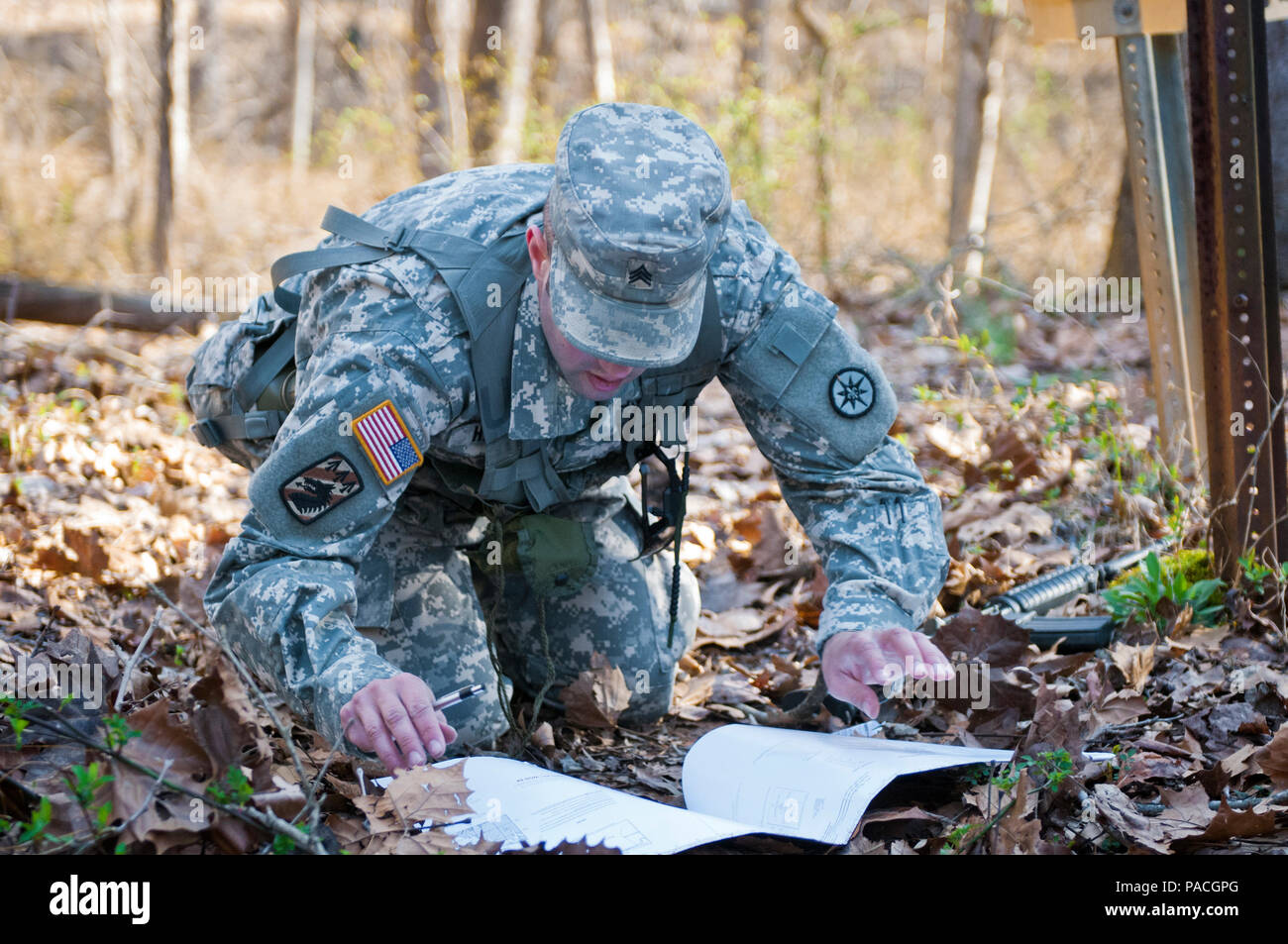 Sgt. James Harvey, with the 619th Transportation Company, writes down ...