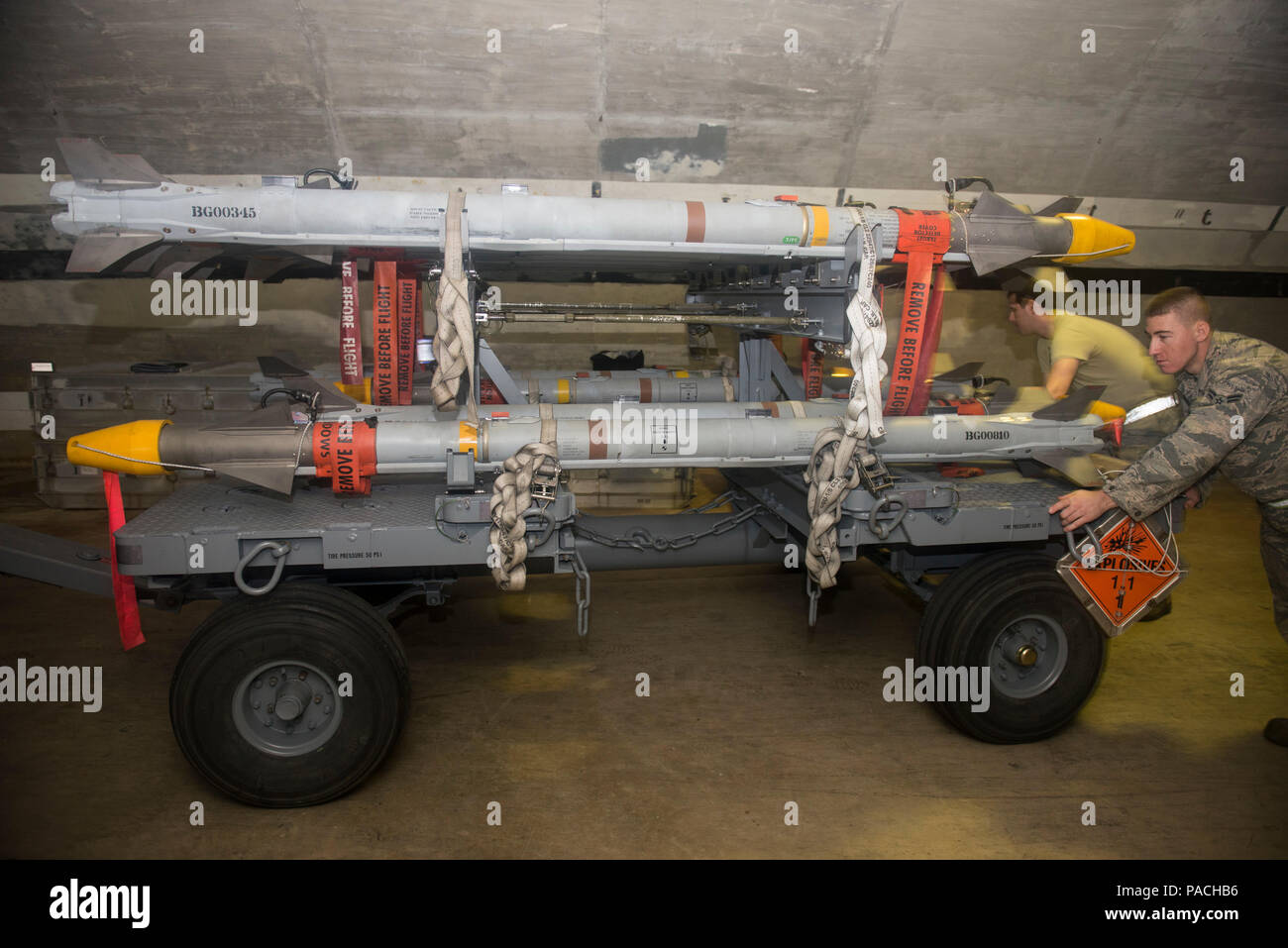 18th Munitions Squadron Airmen move AIM-9X Sidewinder missiles to the ...
