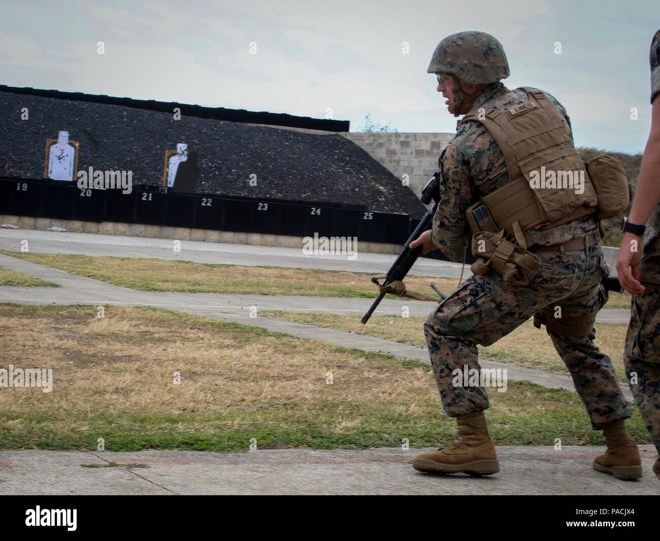 Cpl. Zachary Summers, a radio operator with 3rd Radio Battalion, runs ...