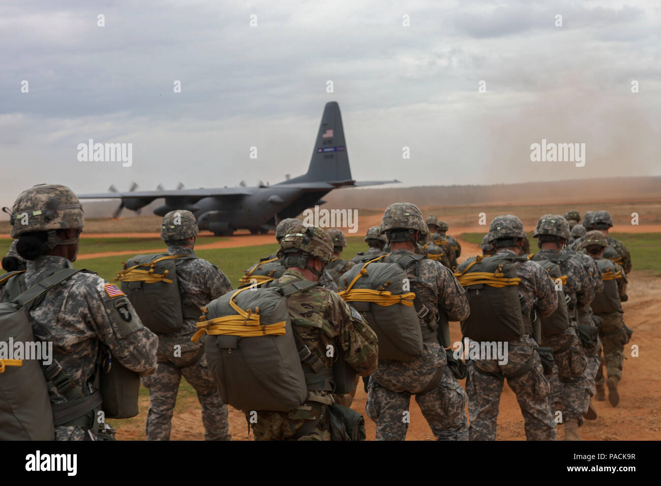U.S Army paratroopers walk towards a C-130 Hercules for an airborne ...