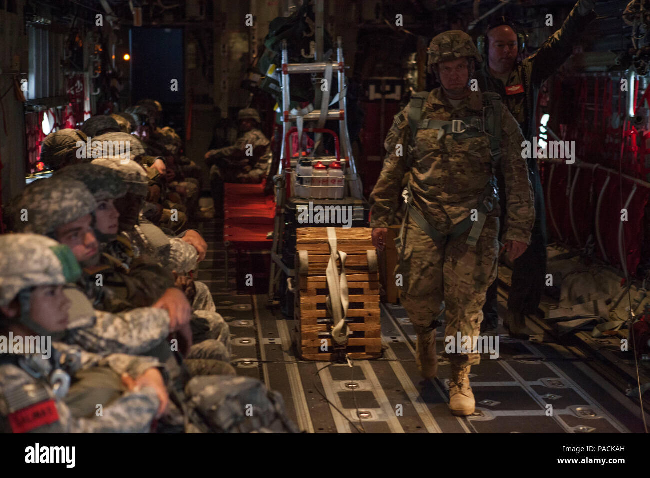 U.S. Army paratroopers initiate jump procedures for a ramp jump from ...