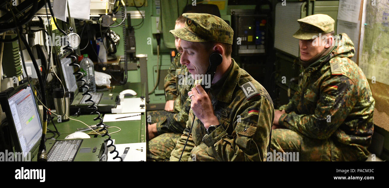 German soldiers with the 131st Artillery Battalion plan fire missions ...