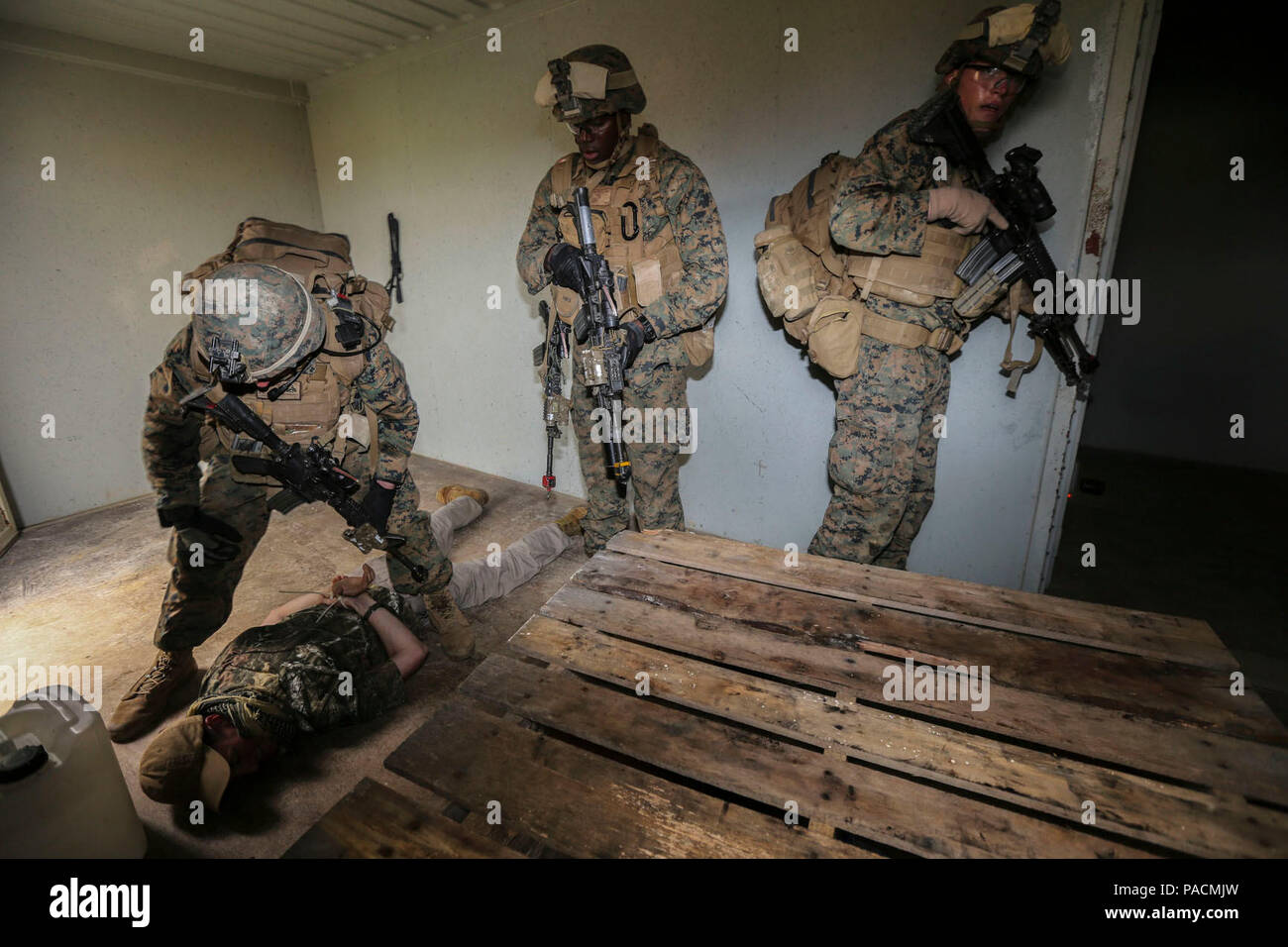 U.S. Marines with Combined Task Force (CTF) 13 apprehend an enemy role ...