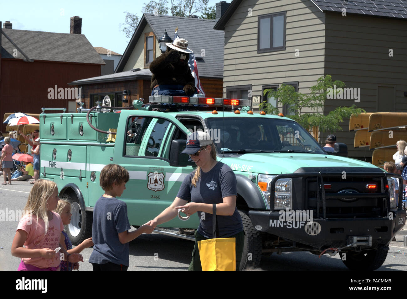 A US Forest Service truck in a July 4th parade with Smokey The Bear ...