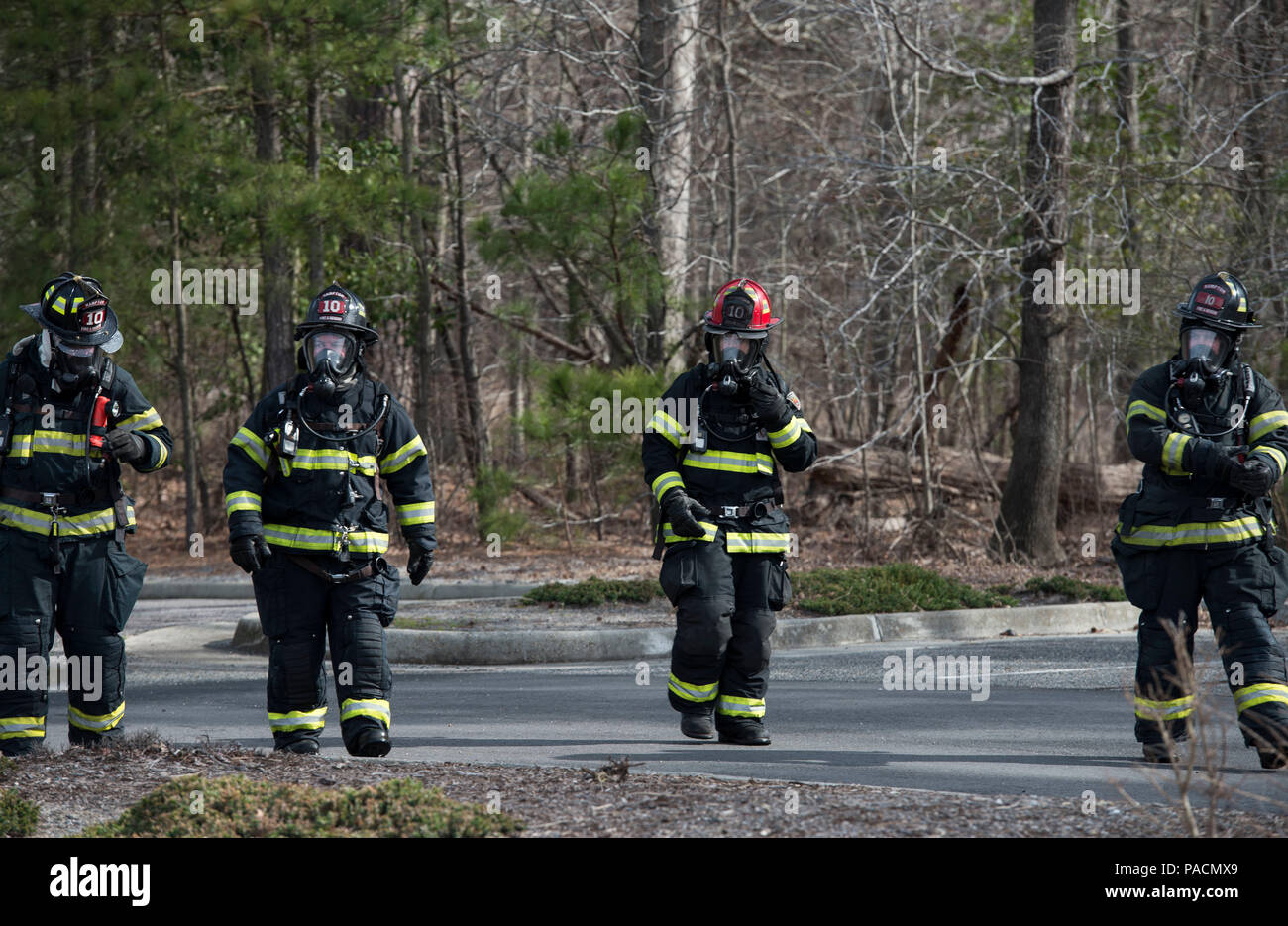 Hampton Division of Fire Rescue firefighters evaluate an aircraft crash ...