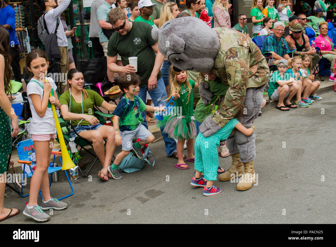 Sgt. Rocky, the 3rd Infantry Division mascot hugs children during his ...
