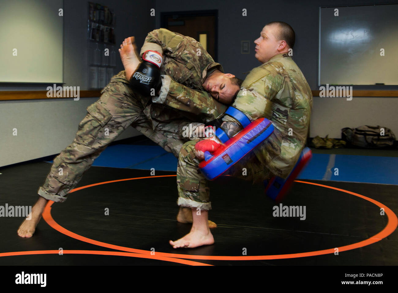 U.S. Army Sgt. Samuel Nobles, performs a takedown to Spc. Franklin ...