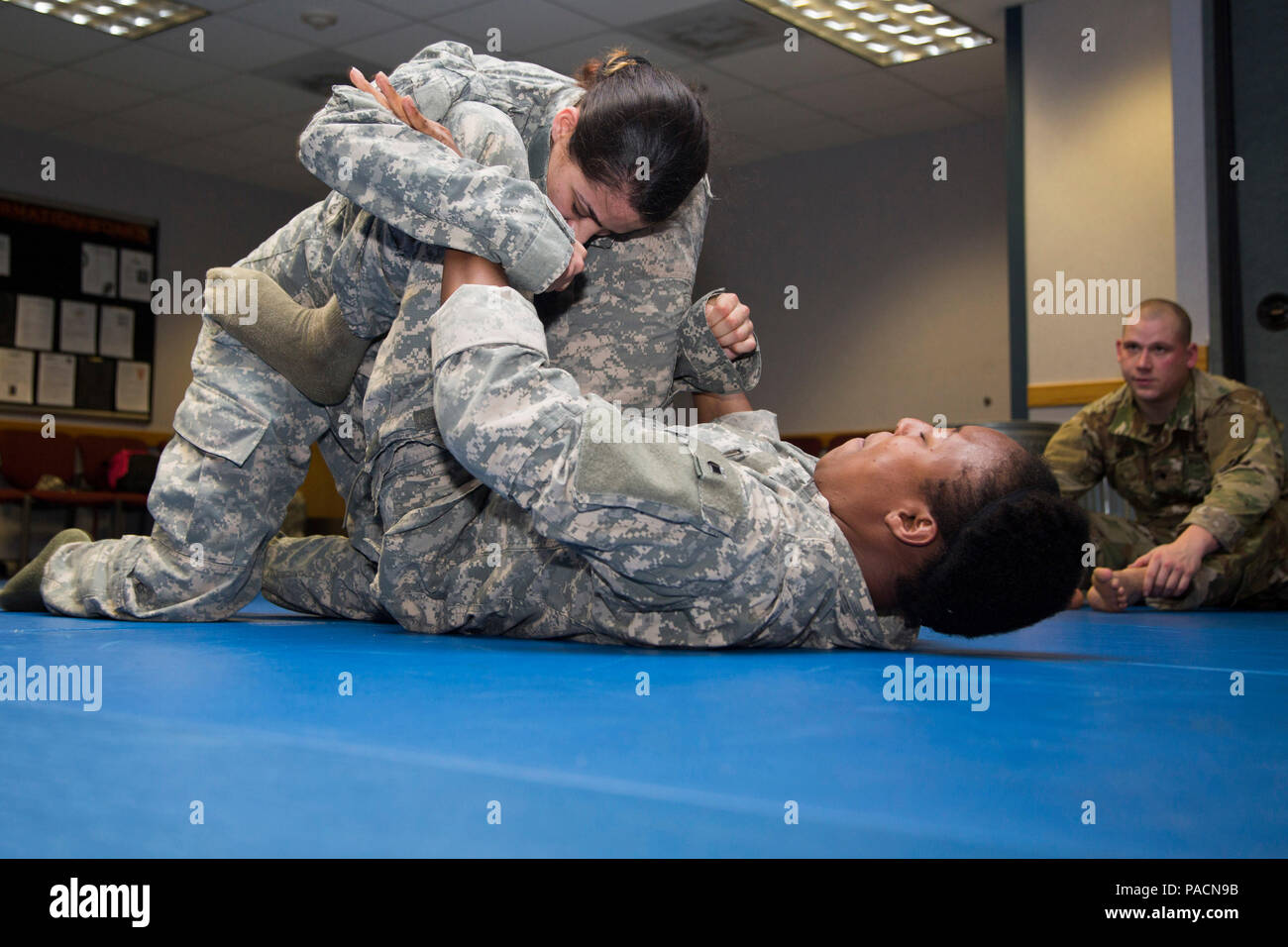 U.S. Army Spc. Ayla Seidel, left, attempts to gain a dominate body ...