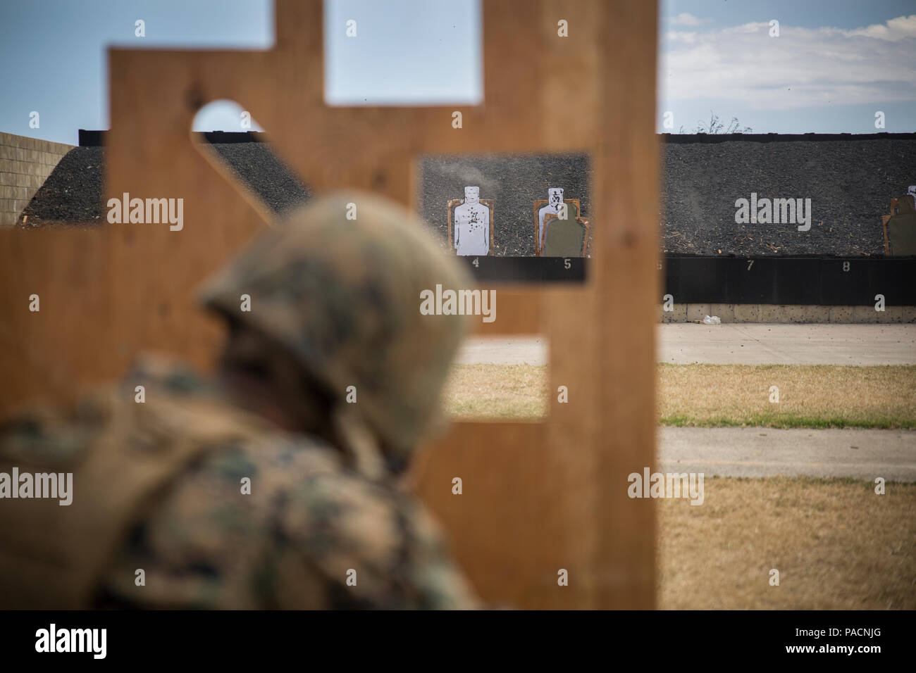 Cpl. Brandon Tallent engages a target during a course of fire in the ...