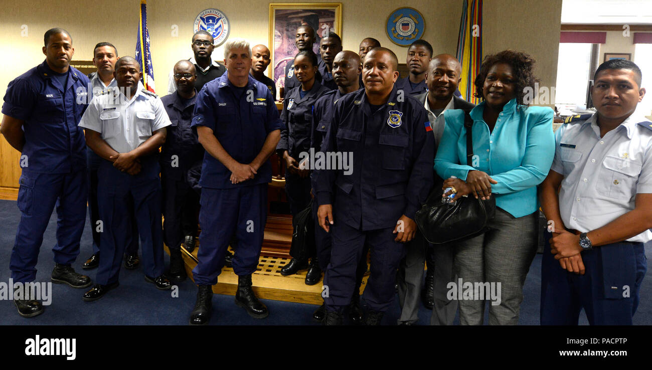 Members of the 8th Coast Guard District pose for a group photo with a ...