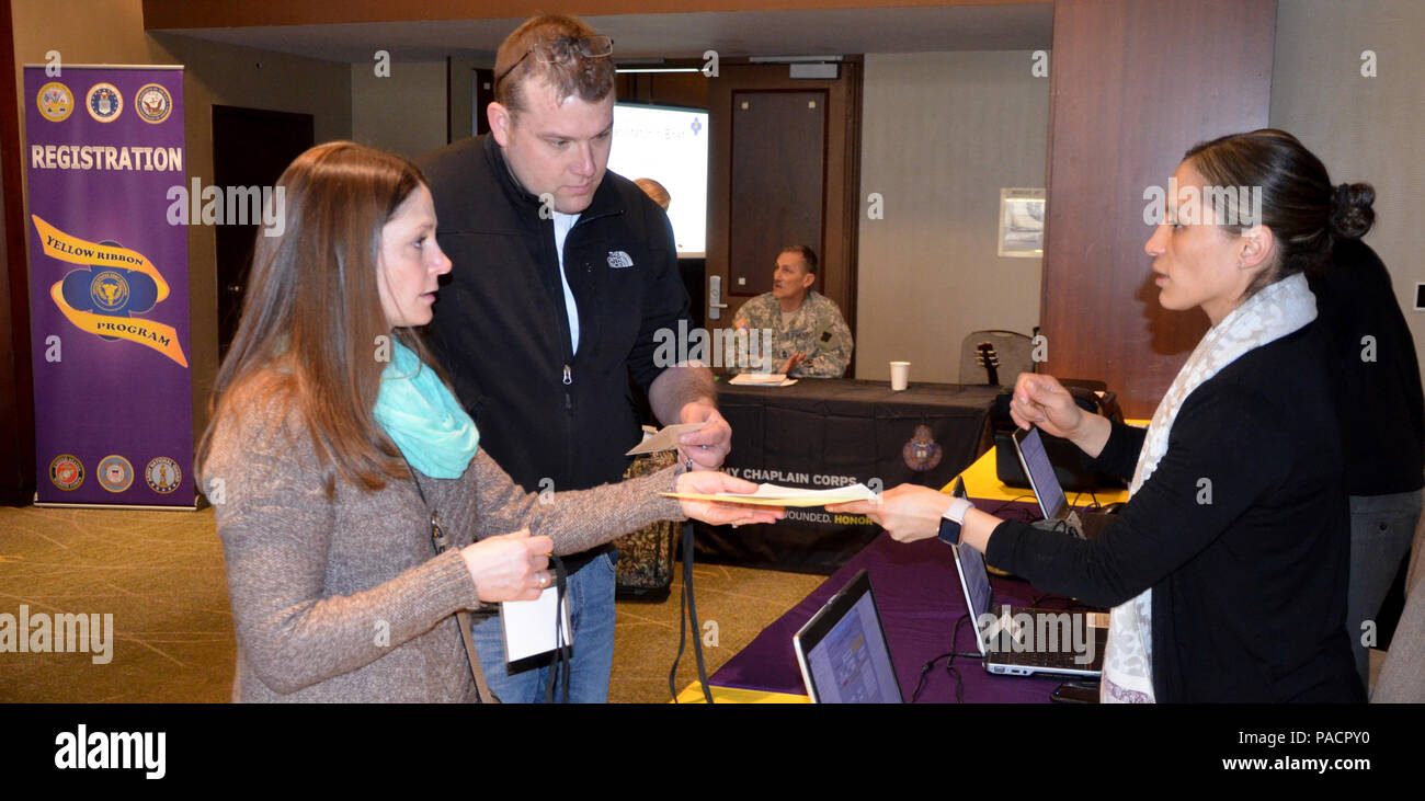 Soldiers and their families register and receive welcome packets at the ...