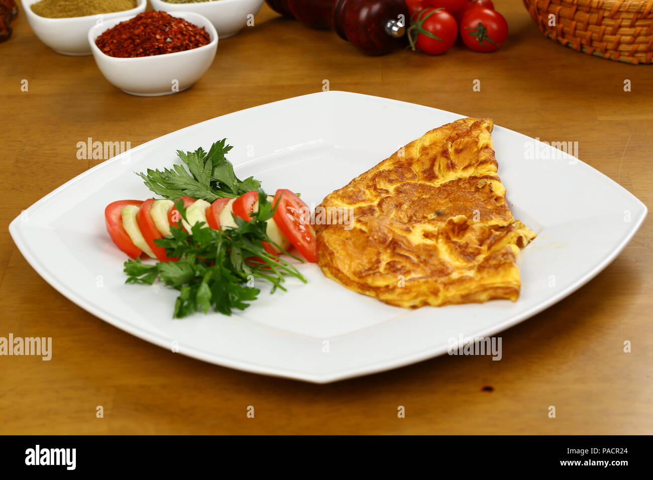 Breakfast omelette with french fries and garnish Stock Photo - Alamy