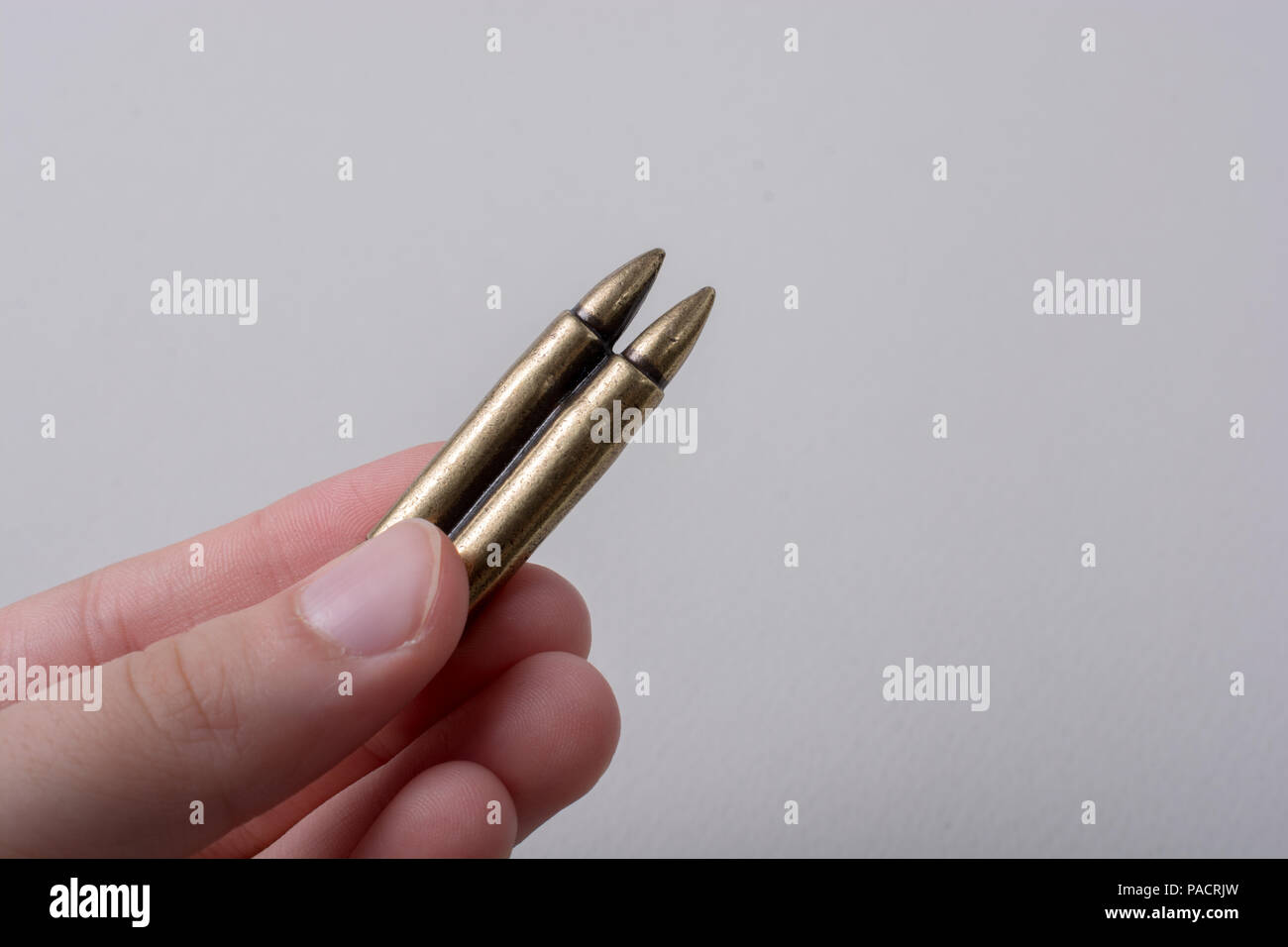 Bullet in the hand as Conceptual photography against the war Stock ...