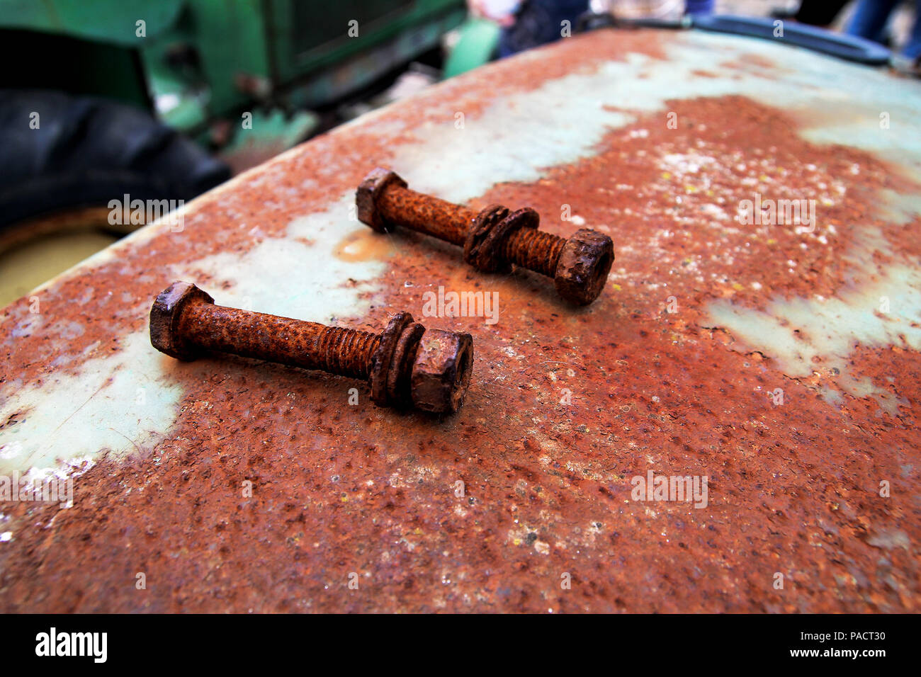 Two rusty screws on a rusty surface Stock Photo - Alamy