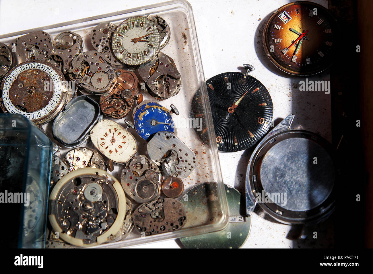 Old clocks and parts clockworks in drawers Stock Photo - Alamy
