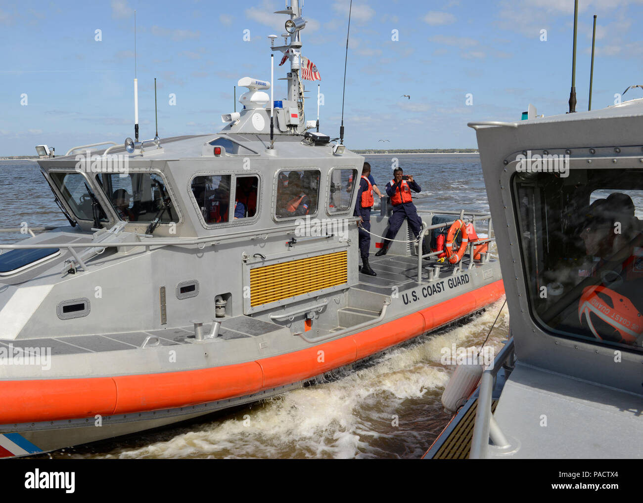 GULFPORT, Miss. - Members from the Belize and Haitian Coast Guard take ...