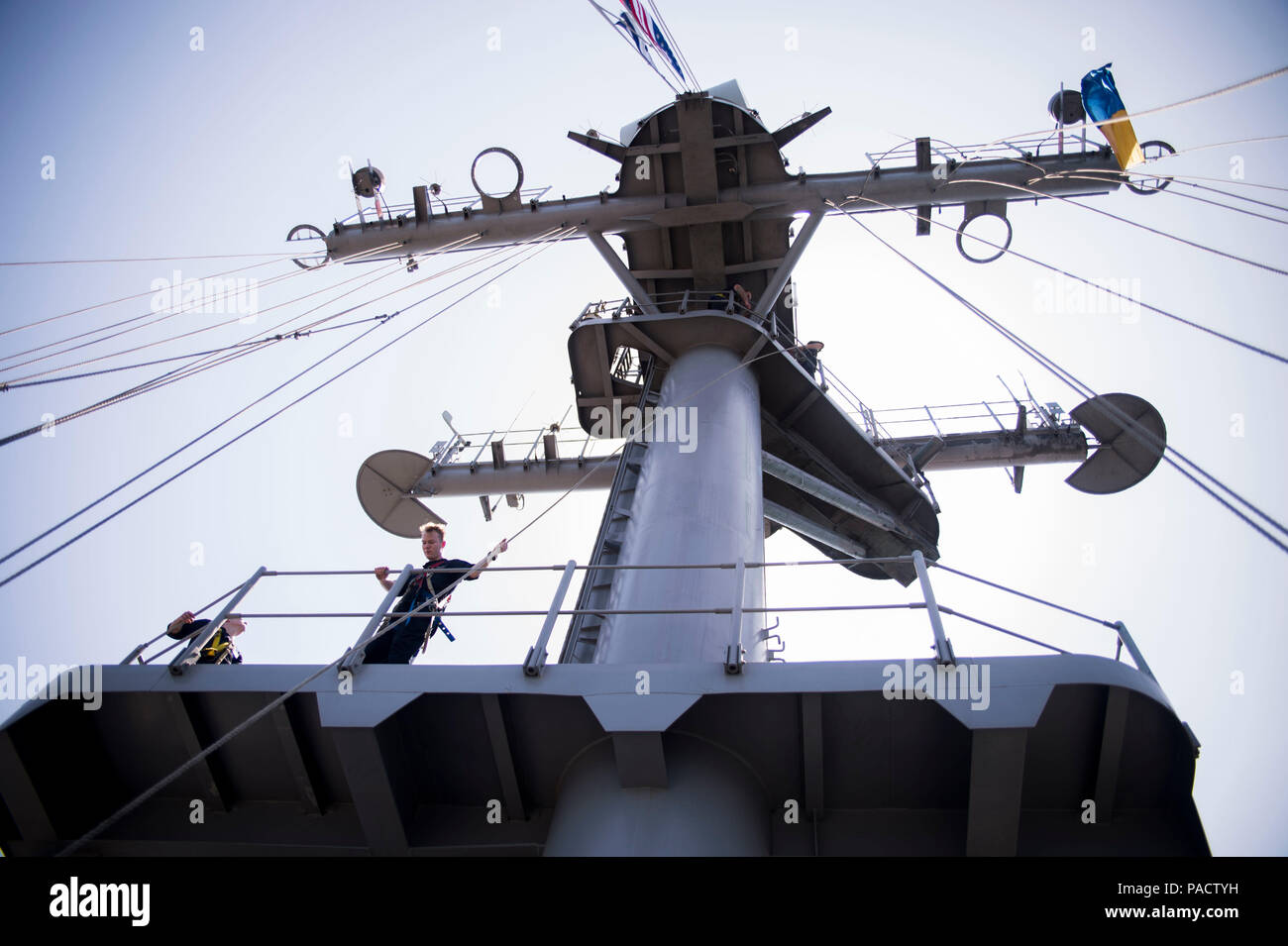 160313-N-YL073-397 GULF OF OMAN (March 13, 2016) Sailors work aloft on ...