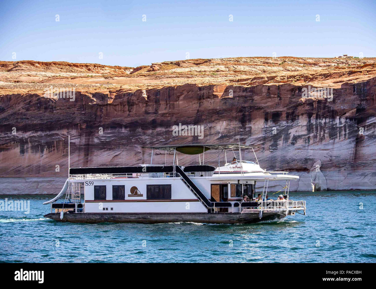 Arizona, USA. 31st May, 2018. Houseboat entering colorful, narrow ...
