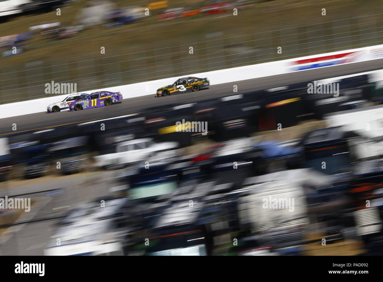 Loudon, New Hampshire, USA. 21st July, 2018. Ryan Truex (11) races down ...