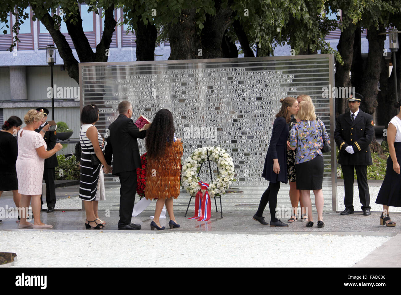 Oslo, Norway. 22nd July, 2018. People pay tribute to the victims of the ...
