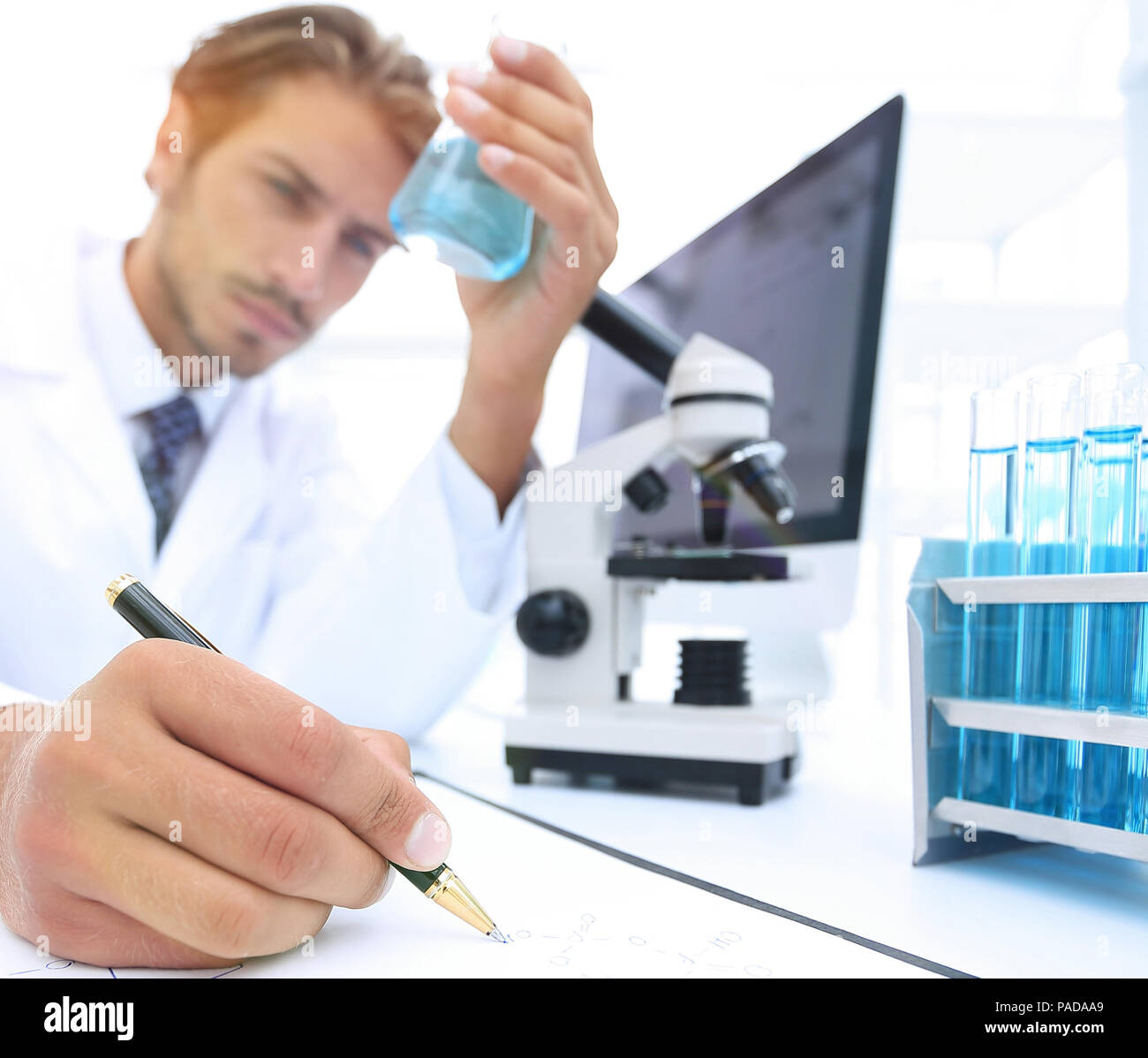 scientist analyzing an experiment in a laboratory Stock Photo - Alamy