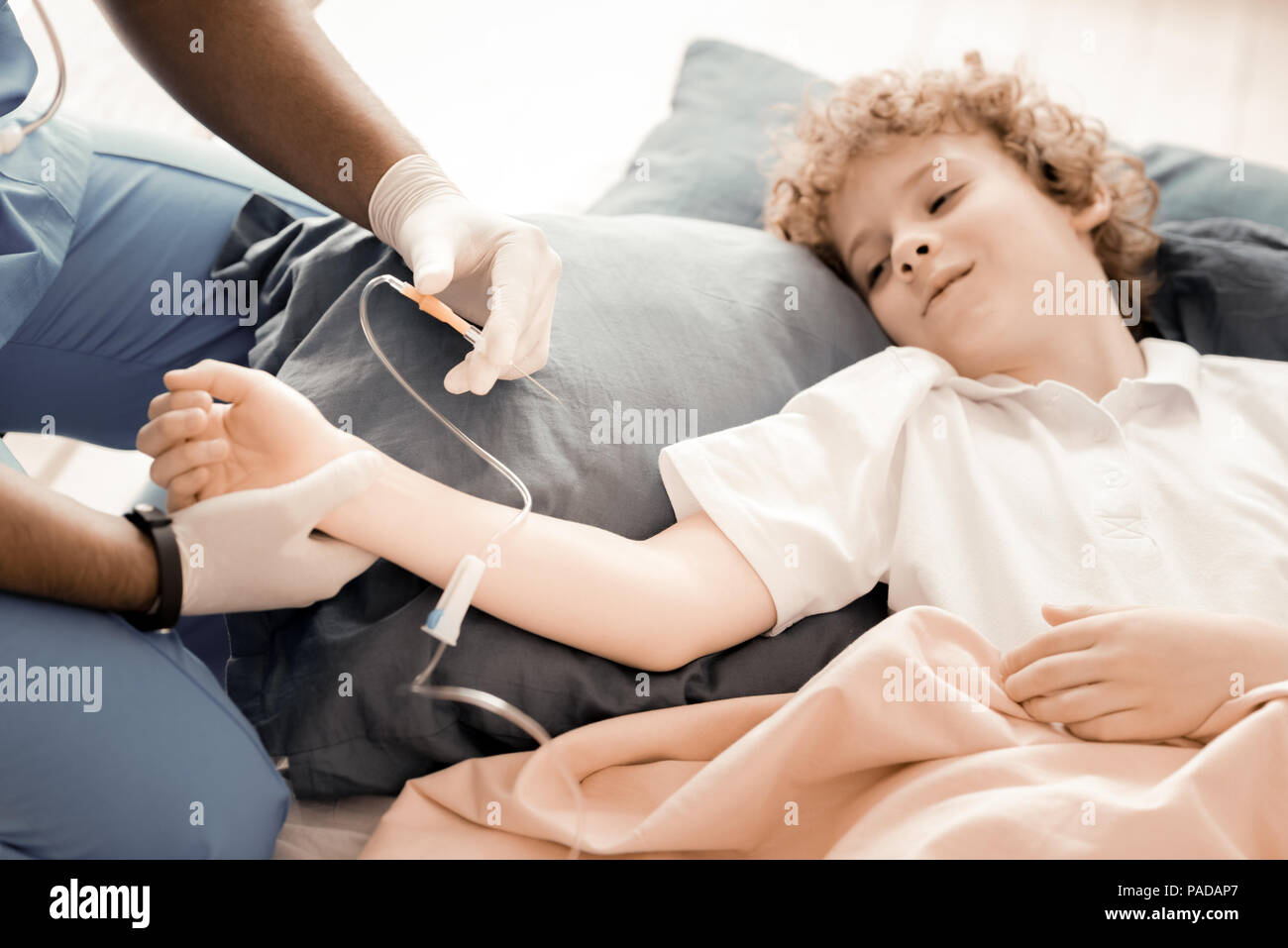 Tired boy wishing to be healthy Stock Photo - Alamy