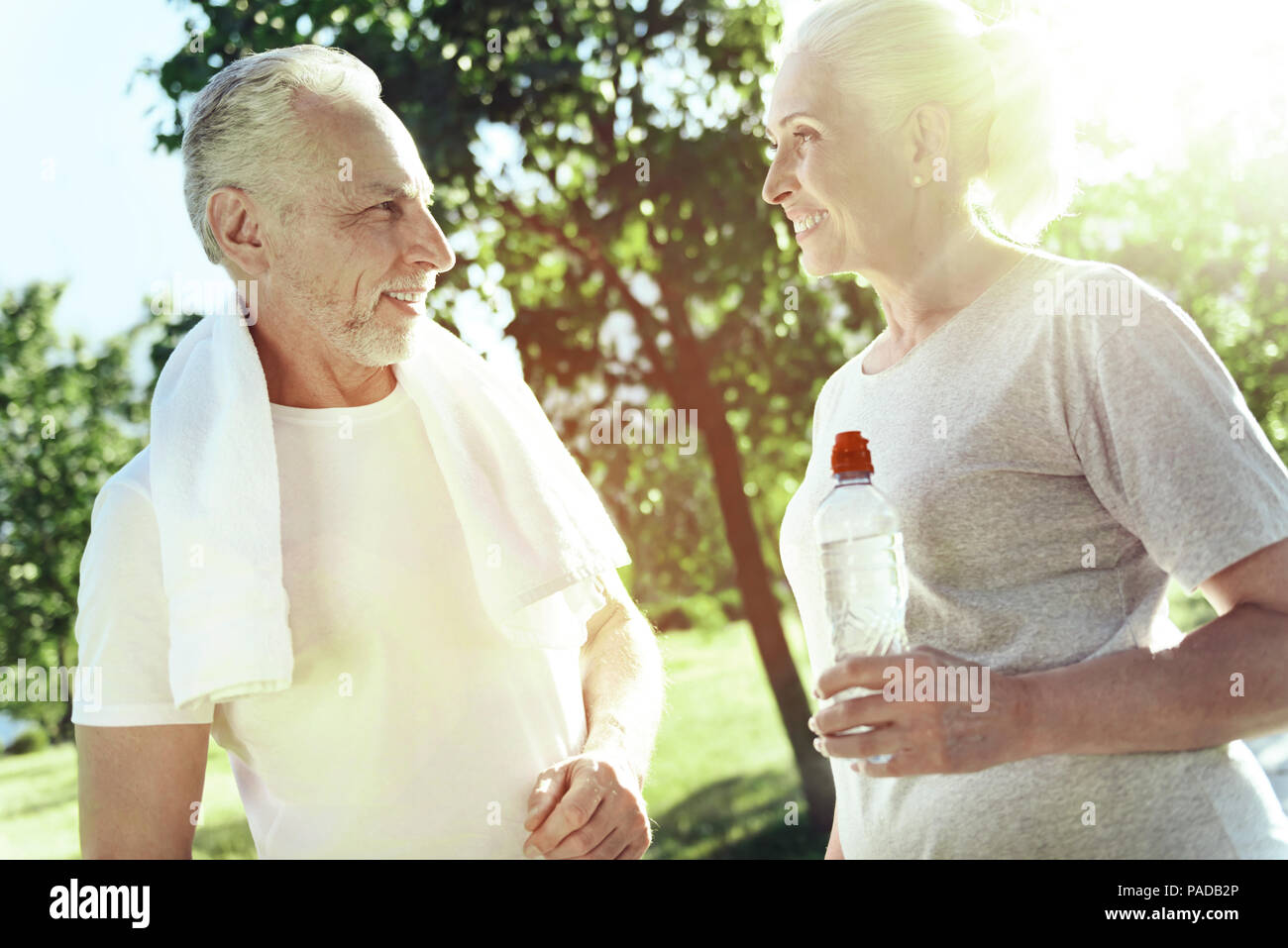 Senior people talking outside hi-res stock photography and images - Alamy
