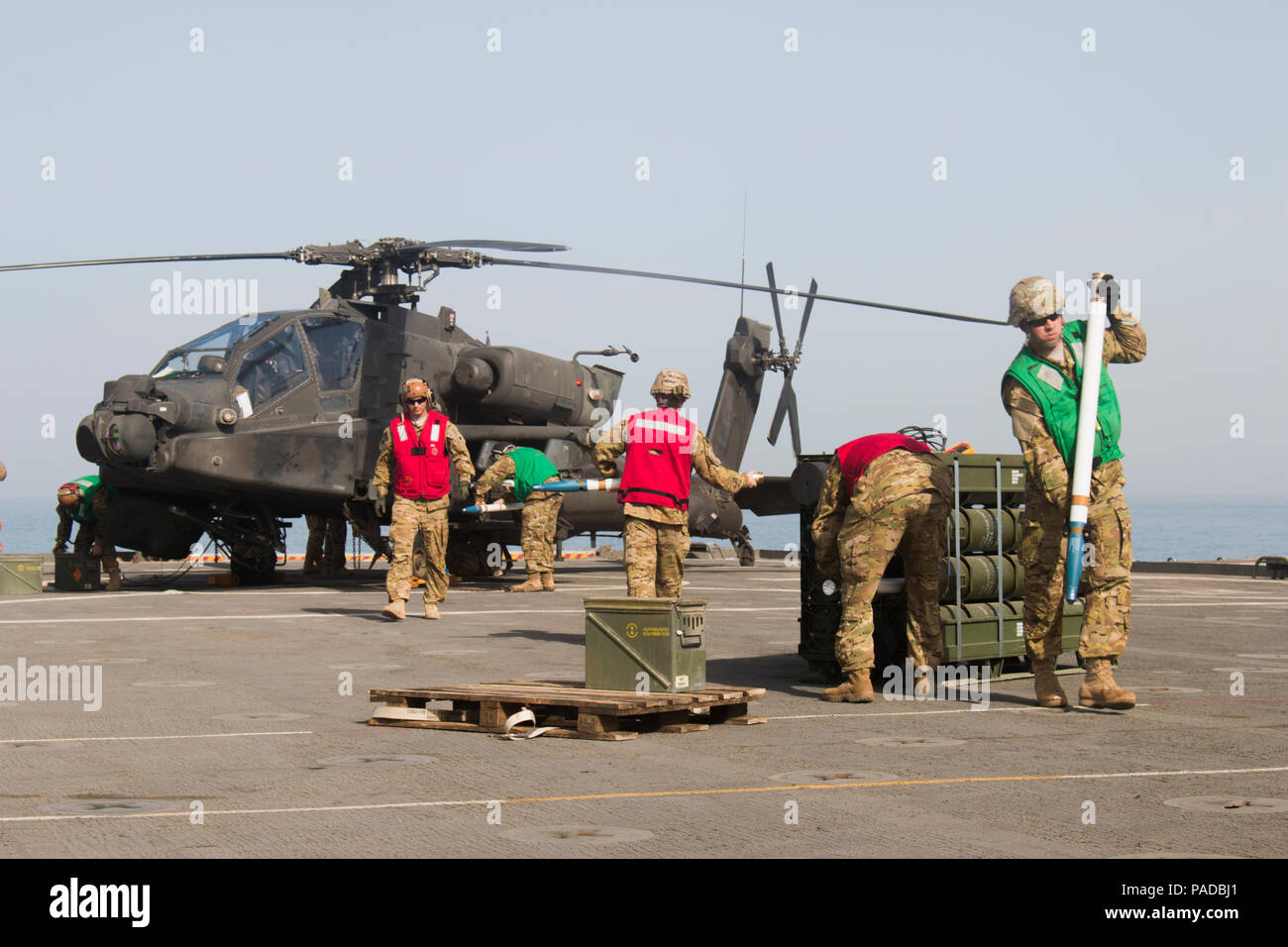 40th Combat Aviation Brigade Soldiers arm AH-64 Apache helicopters from ...