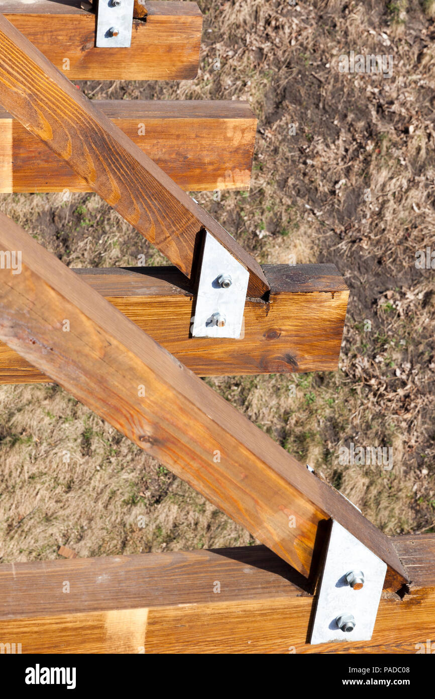 The place of attachment and connection of the wooden bridge structure ...