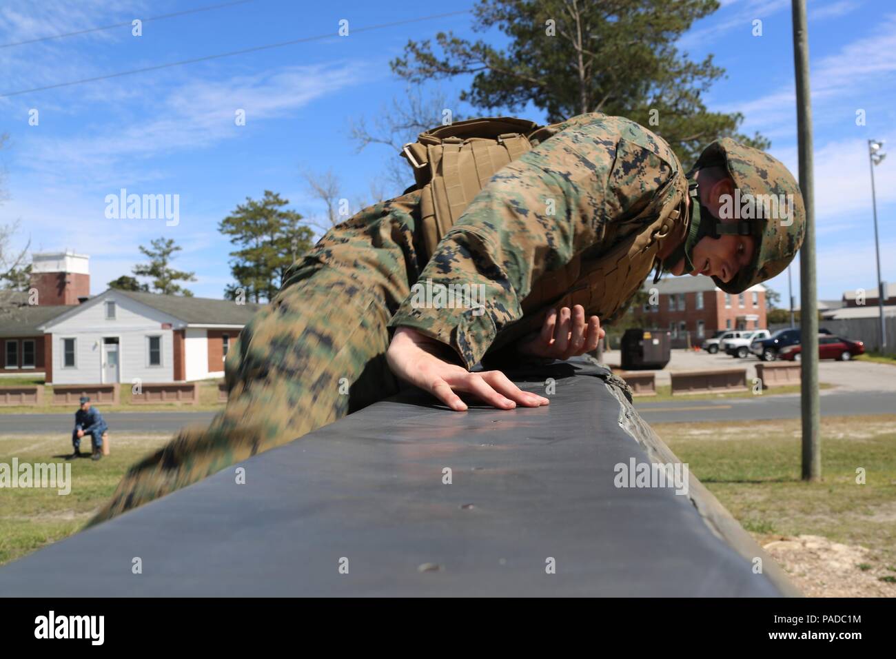 Sgt. Scott Maynard negotiates an obstacle during a team building ...