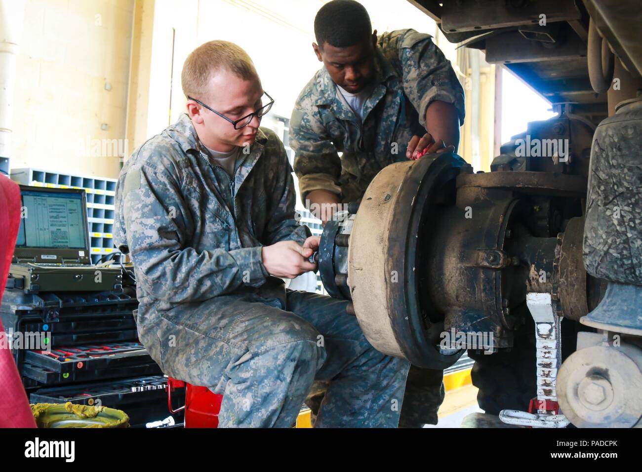 Two wheeled vehicle mechanics with Headquarters Service Company, 122nd ...