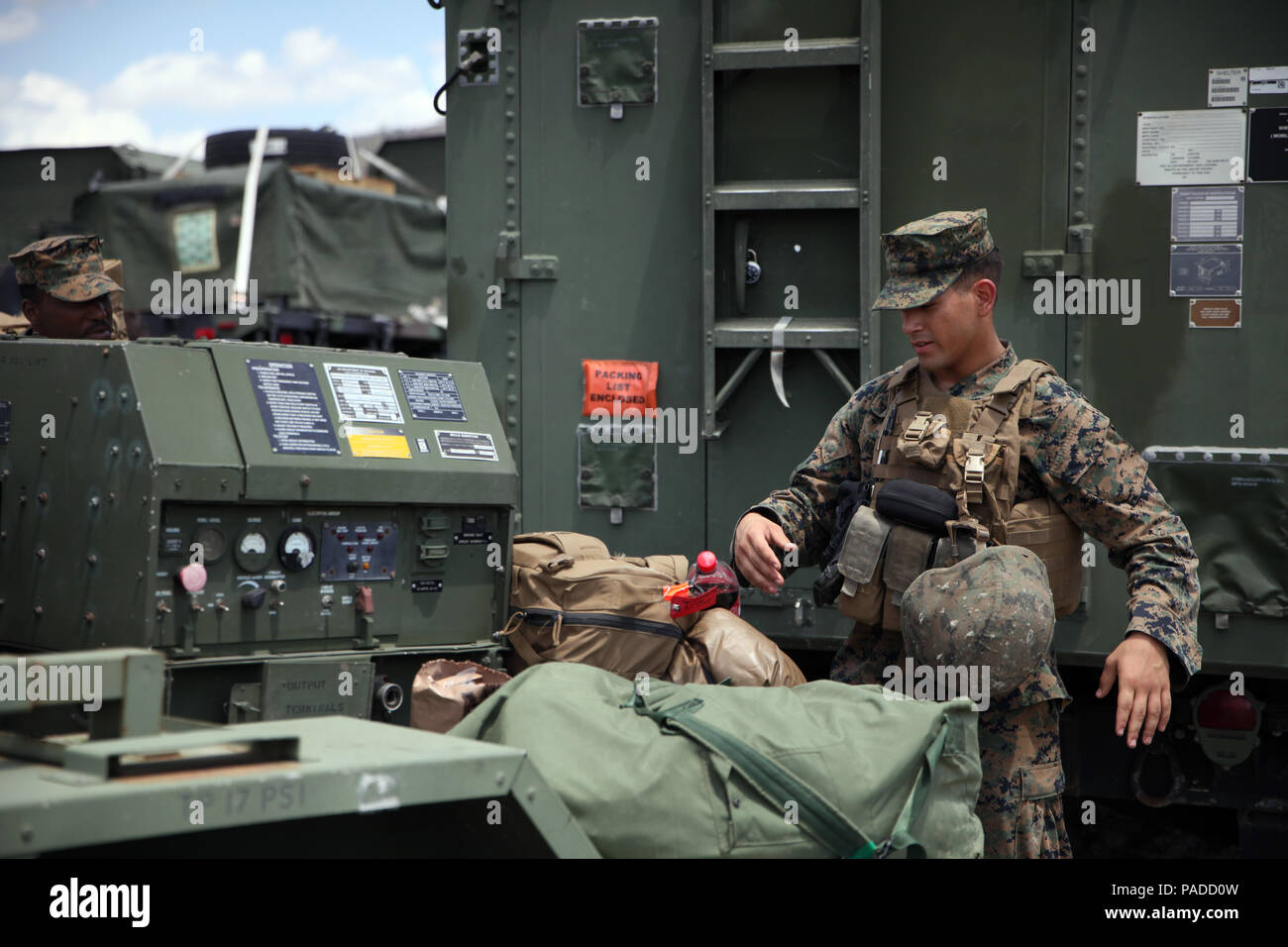 U.S. Marine Lance Cpl. Jonathan Neale offloads his equipment in ...