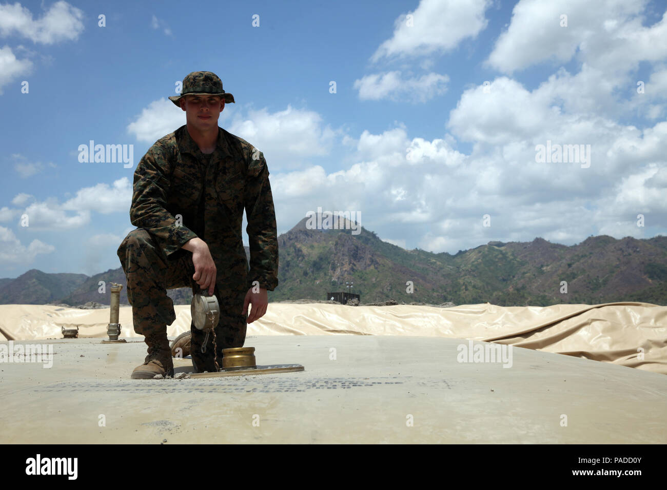 U.S. Marine Lance Cpl. Christopher Jones poses for a photo on top of a ...