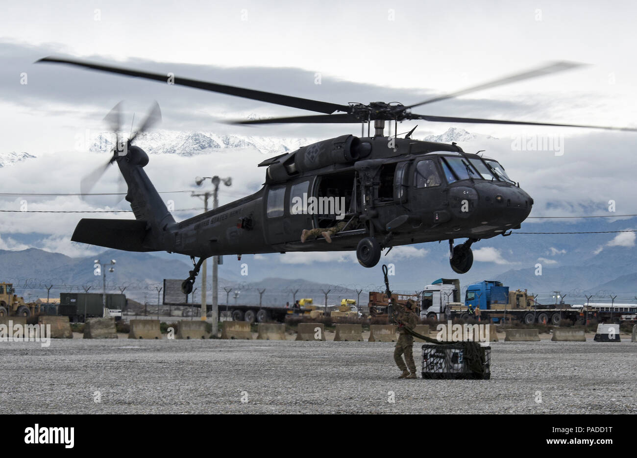 Soldiers assigned to Task Force – Iron Eagle prepare to connect a sling ...